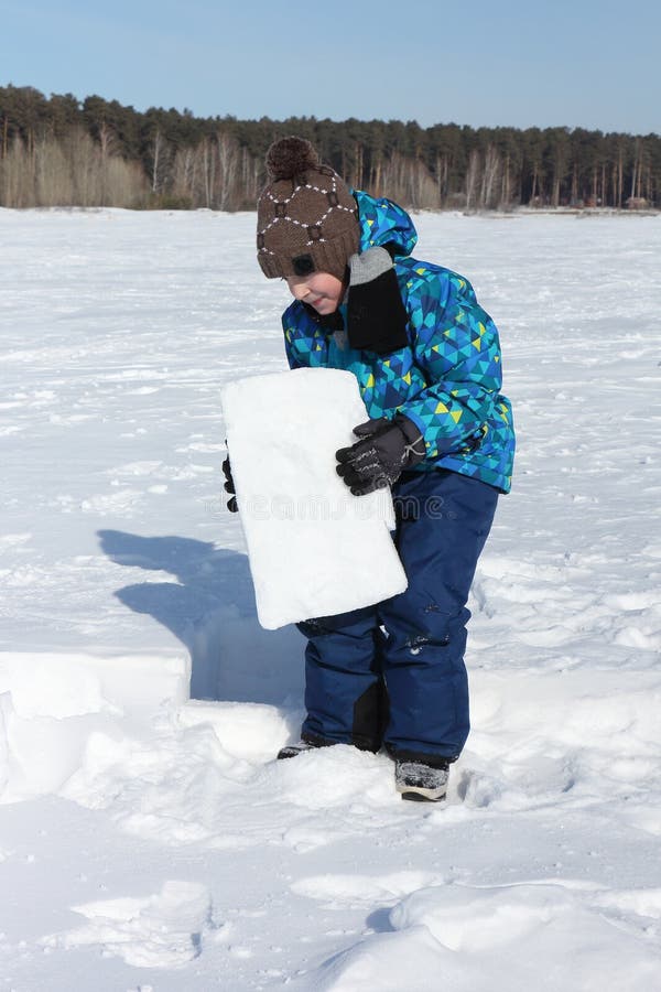 Happy Cheerful Boy Building an Igloo Stock Photo - Image of igloo ...