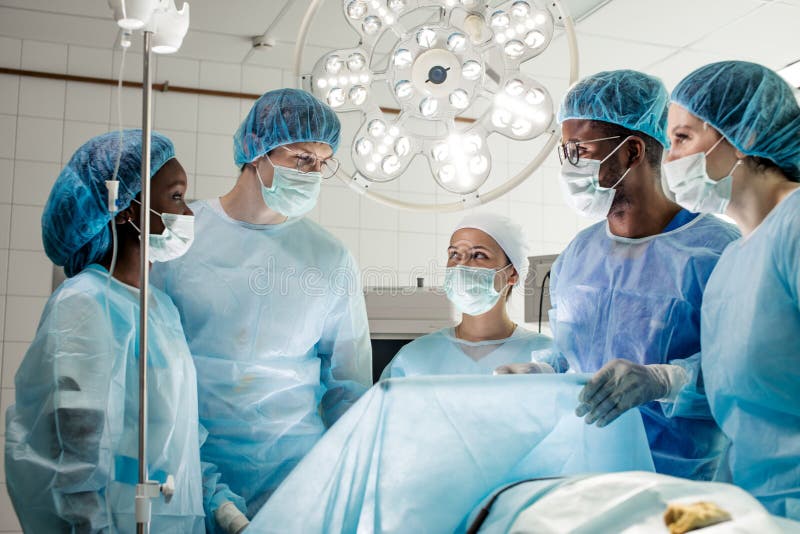 Happy Cheerful Diverse Doctors Standing Around the Partient`s Bed Stock ...