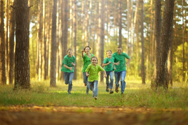Happy Cheerful Family Running Stock Photo - Image of relax, girl: 44026294