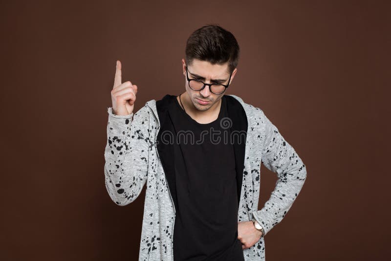 Happy Cheerful Young Guy Gesturing Up with Fingers. Stock Photo - Image ...