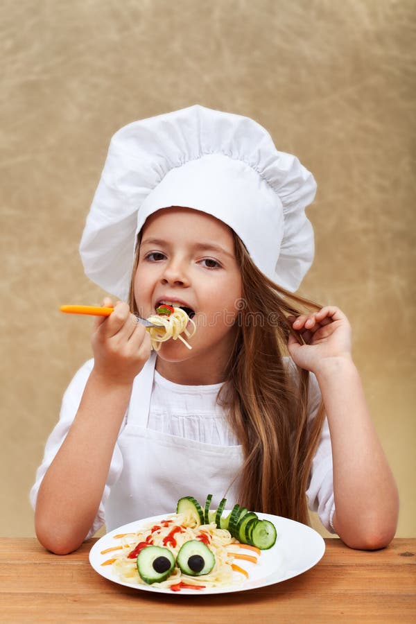 Happy Chef Child Eating a Creative Pasta Dish Stock Photo - Image of ...