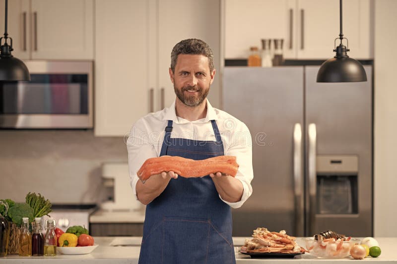 Happy Chef Man Cooking Fish. Chef Man Cooking Fish Salmon Stock Photo ...