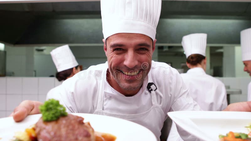 Happy Chef Looking at Camera Holding a Dessert on a Green Screen ...