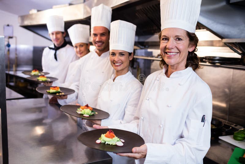 Happy Chefs Team Standing Together in Commercial Kitchen Stock Photo ...