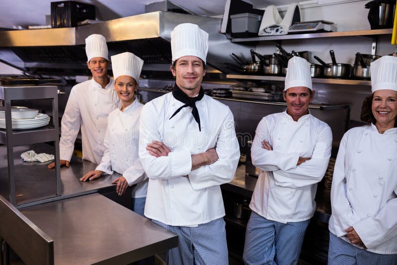 Happy Chefs Team Standing Together in Commercial Kitchen Stock Photo ...