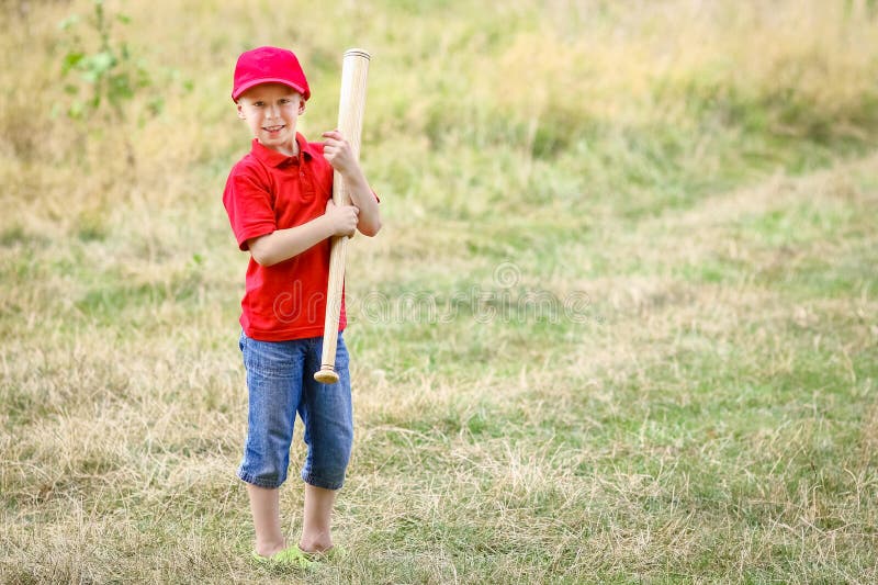 A Happy Child with Baseball Bat on Nature Concept in Park Stock Image ...