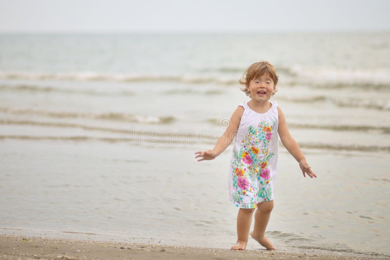 Happy child in the beach stock image. Image of people - 37995321