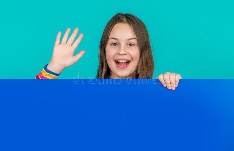 Happy Child Behind Blank Blue Paper with Copy Space for Advertisement ...