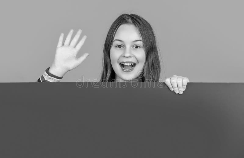 Happy Child Behind Blank Blue Paper with Copy Space for Advertisement ...