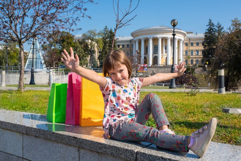 The Happy Child in the City with Packages for Purchases Stock Photo ...