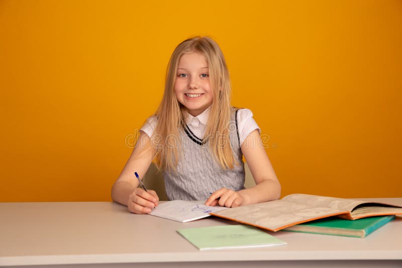 Happy Child Doing Homework Sitting Isolated the Bright Yellow ...