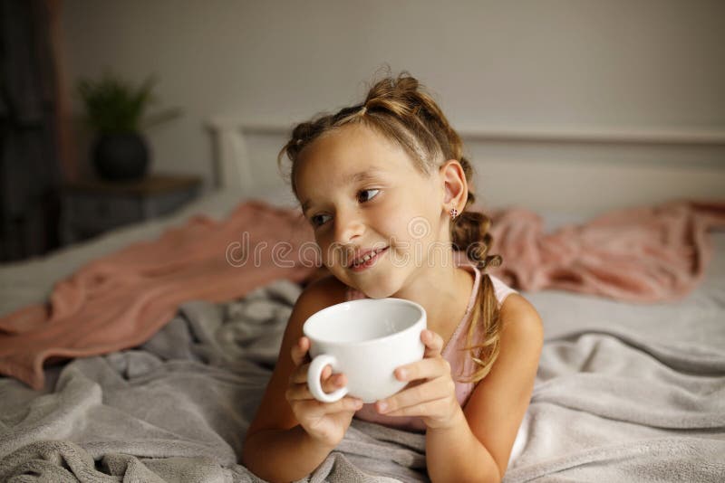 Happy Child Drinking Tea in the Bed Stock Photo - Image of health ...