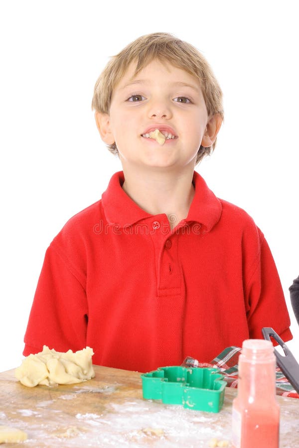 Happy child eating batter stock image. Image of health - 4025503