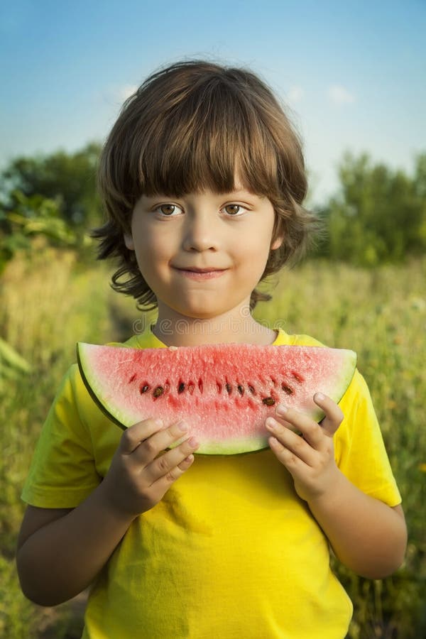 Happy Child Eating Watermelon Stock Photo - Image of grass, babies ...