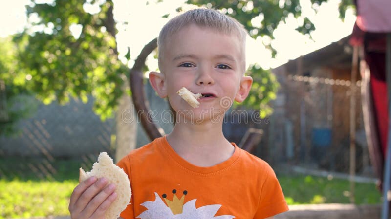 A Happy Child Eats Bread. Child S Smile. a Child Has Bad Teeth. White ...