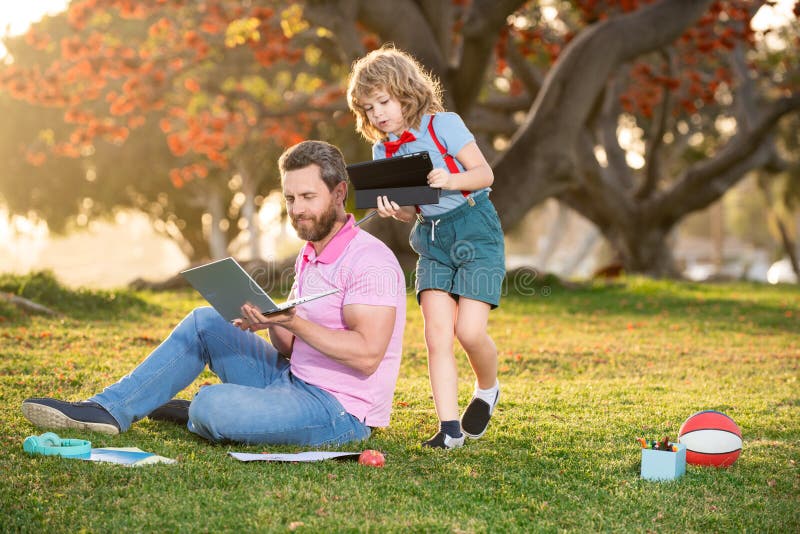 Happy Child with Father Learning Outdoor by Studying Online and Working ...