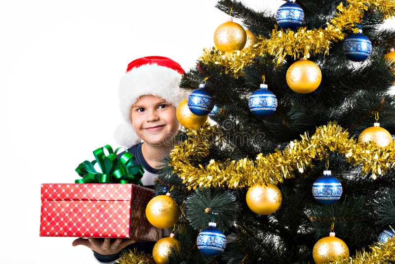 Happy Child with Gift Near Christmas Tree Stock Photo - Image of years ...