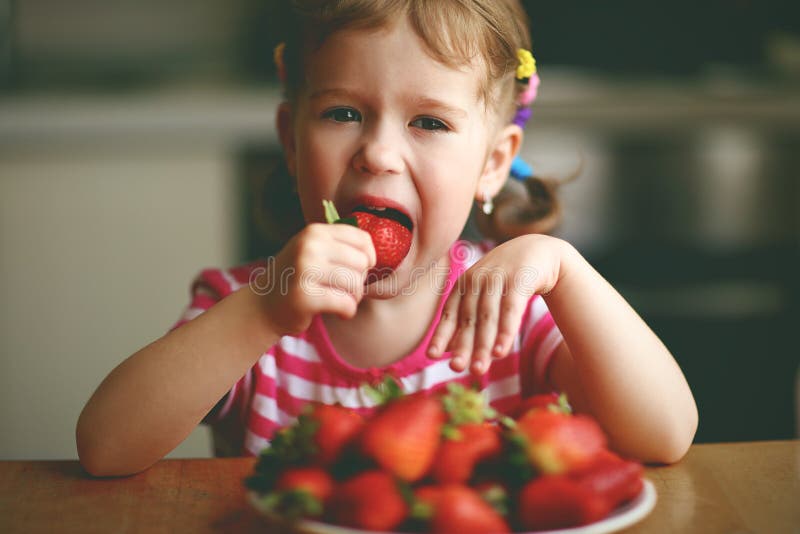 Happy Child Girl Eats Strawberries Summer Home Kitchen Stock Photos ...