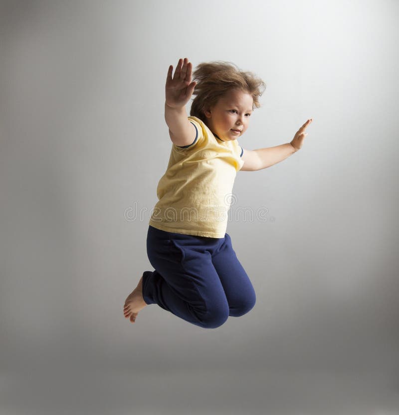 Happy Child Jumping on Grey Background Stock Photo - Image of children ...