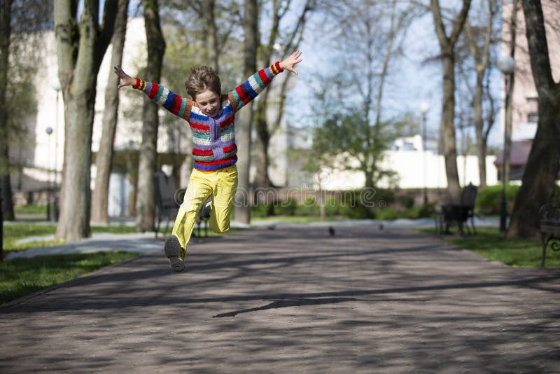 Happy child is jumping stock photo. Image of sport, playing - 198314704