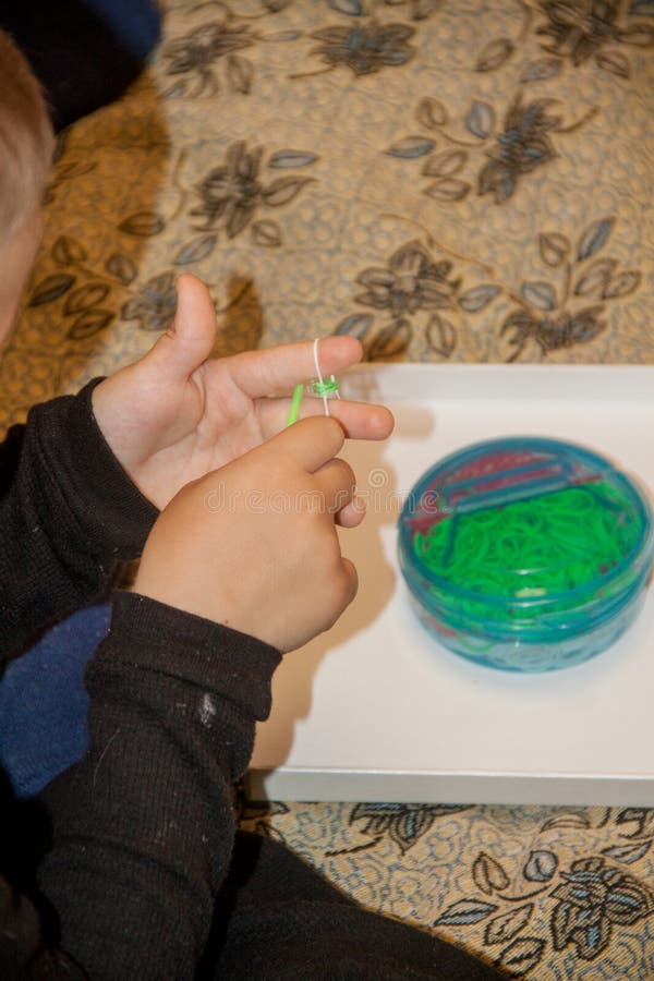 Happy Child Knits an Elastic Band.Kids Hands Stock Photo - Image of ...