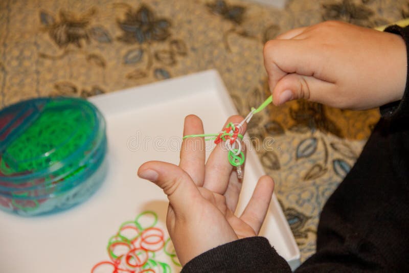 Happy Child Knits an Elastic Band.Kids Hands Stock Photo - Image of ...