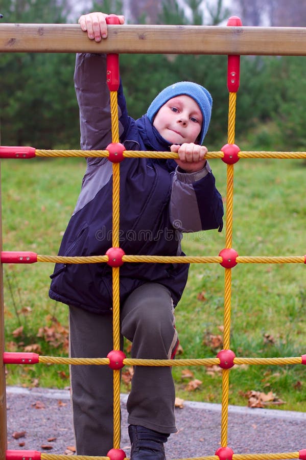 Happy Child in Playground Climbing Up Playing Stock Image - Image of ...