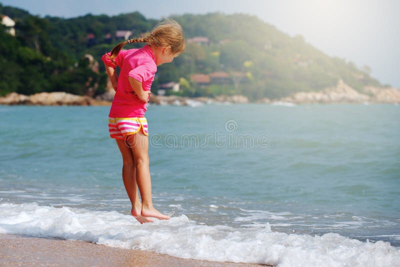Happy Child Playing in Sea. Stock Image - Image of family, copy: 74593327