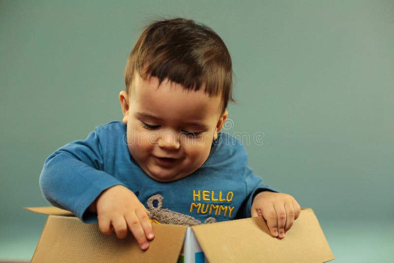 Little toddler in box stock image. Image of baby, eyes - 110833113