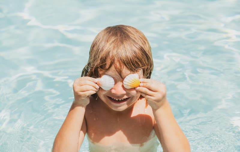 Happy Child Playing in Swimming Pool. Summer Vacation Concept. Covered ...
