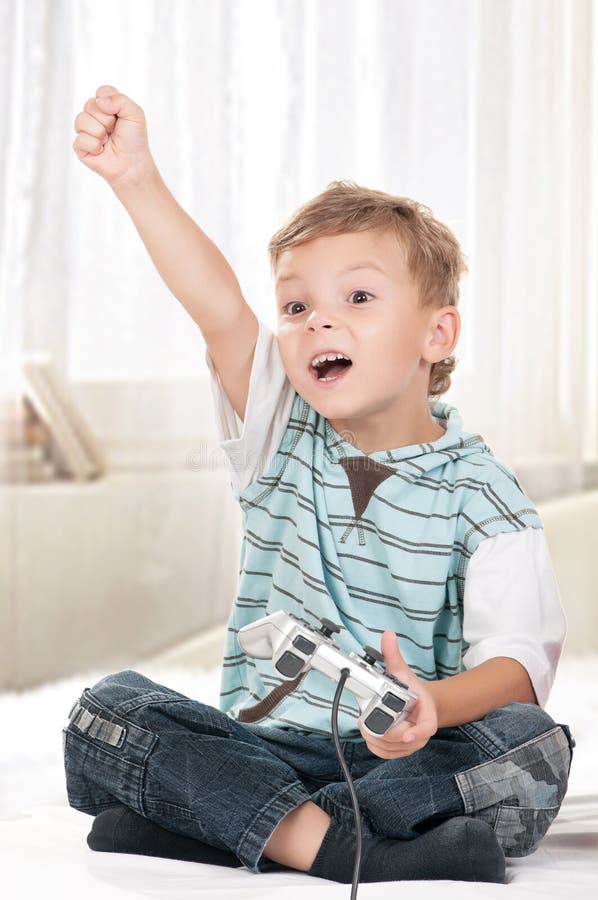 Happy Child Playing a Video Game Stock Image - Image of electronic ...