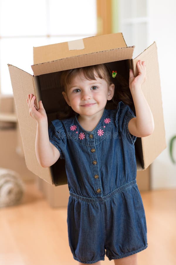 Happy Child Playing with Boxes after Moving in New House Stock Photo ...