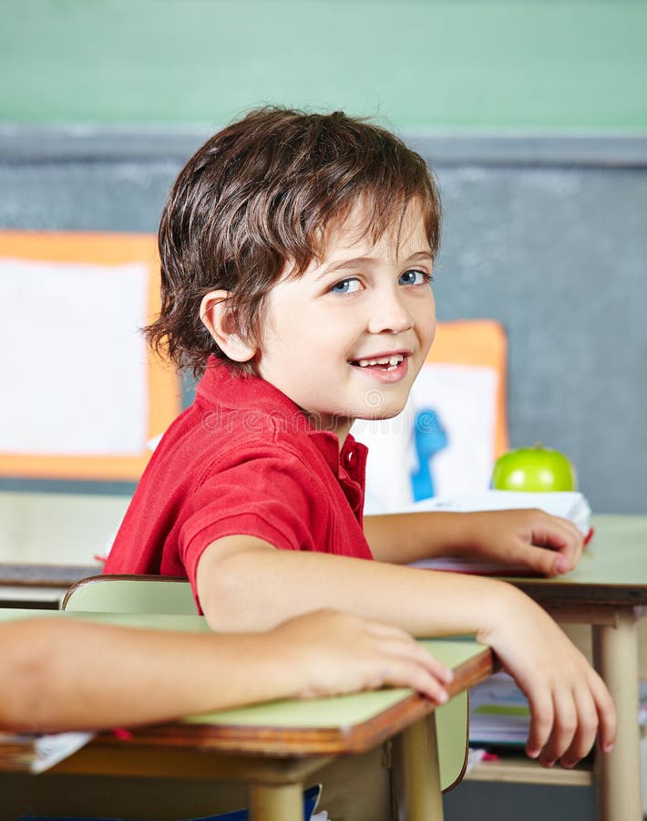 Happy Child Sitting in School Stock Photo - Image of apprenticeship ...