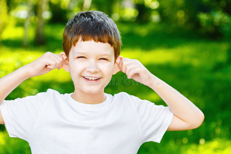 Happy Little Boy Pulling Ears Stock Photos - Free & Royalty-Free Stock ...