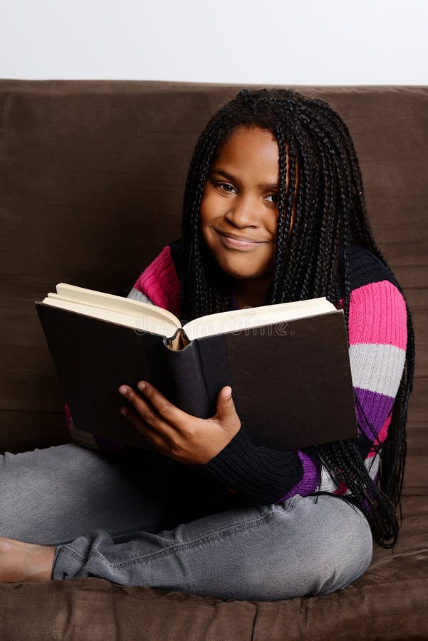 Happy child reading a book stock image. Image of lady - 50257305