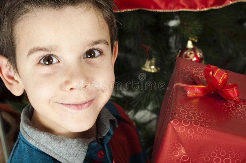 Boy Receiving Christmas Gift from Parents Stock Photo - Image of parent ...