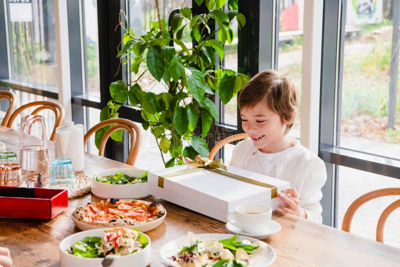 A Happy Child Receiving a Beautiful Gift Stock Photo - Image of cute ...