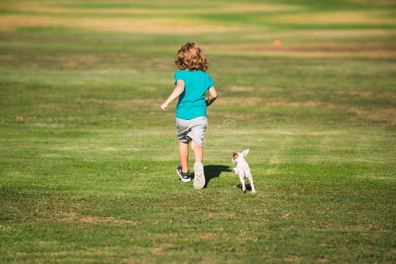 Happy Child Run with a Dog Outdoor. Running Dog. Stock Photo - Image of ...