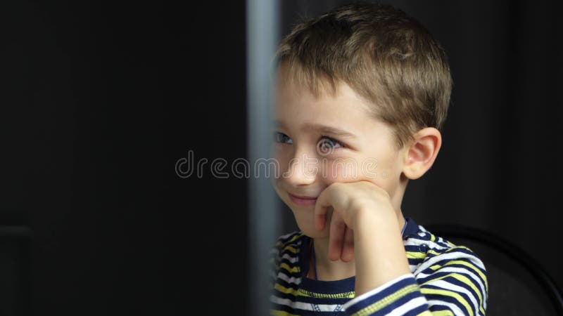 Happy Child Spends Time at the Computer. Home Distance Learning. the ...