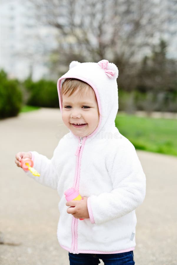 Happy child in spring stock photo. Image of beautiful - 64491590