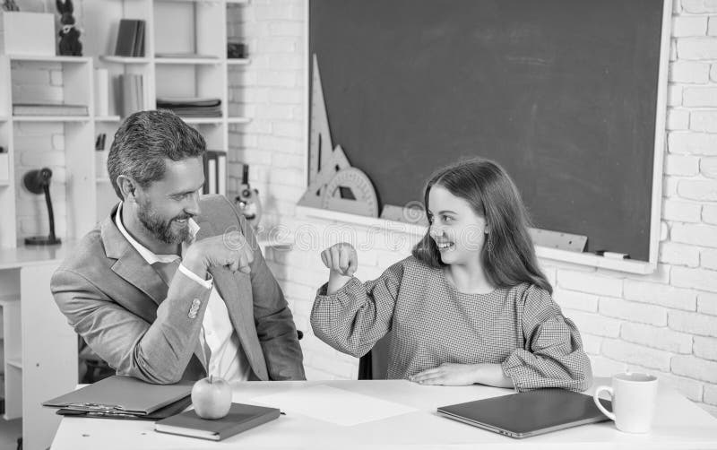 Happy Child Study in Classroom with Tutor. Fist To Fist Stock Image ...