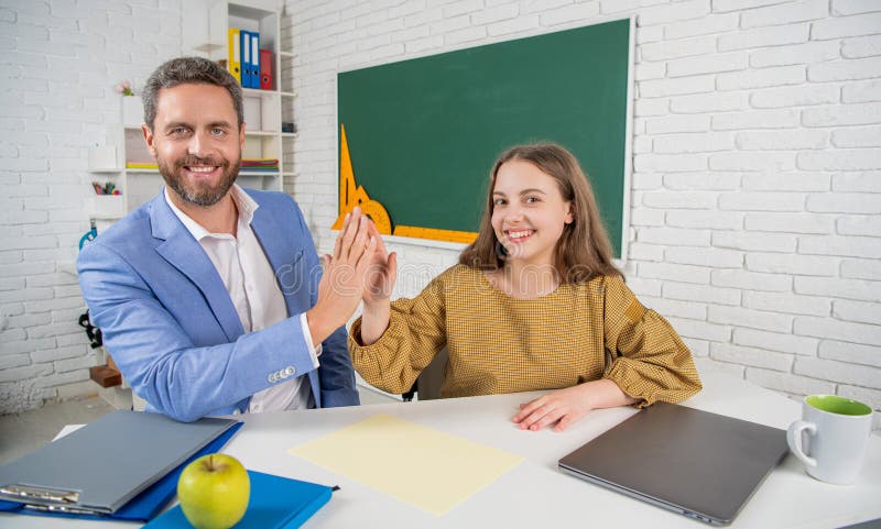 Happy Child Study in Classroom with Tutor. Take Five Stock Photo ...
