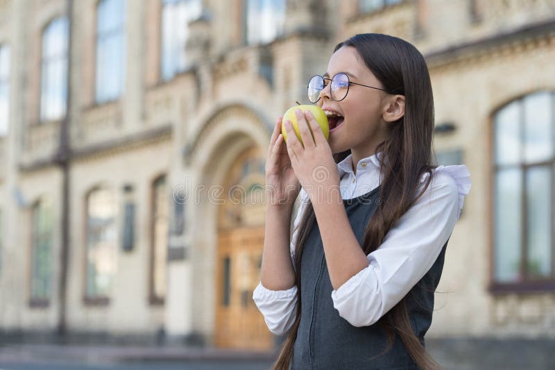 Happy Child in Uniform Eat Vitamin Apple during School Break Outdoors ...