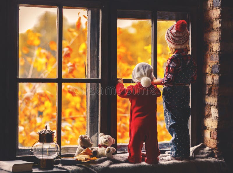 Happy Children Brother and Sister Looking through Windows in Fall Stock ...