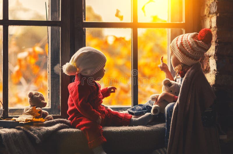 Happy Children Brother and Sister Looking through Windows in Fall Stock ...