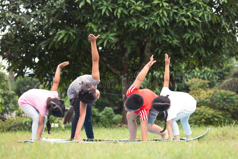 Happy Children Doing Exercise Together in Outdoor Stock Image - Image ...