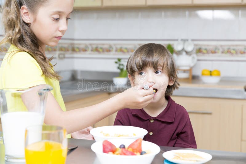 Happy Children Having Breakfast Stock Photo - Image of daughter, cereal ...
