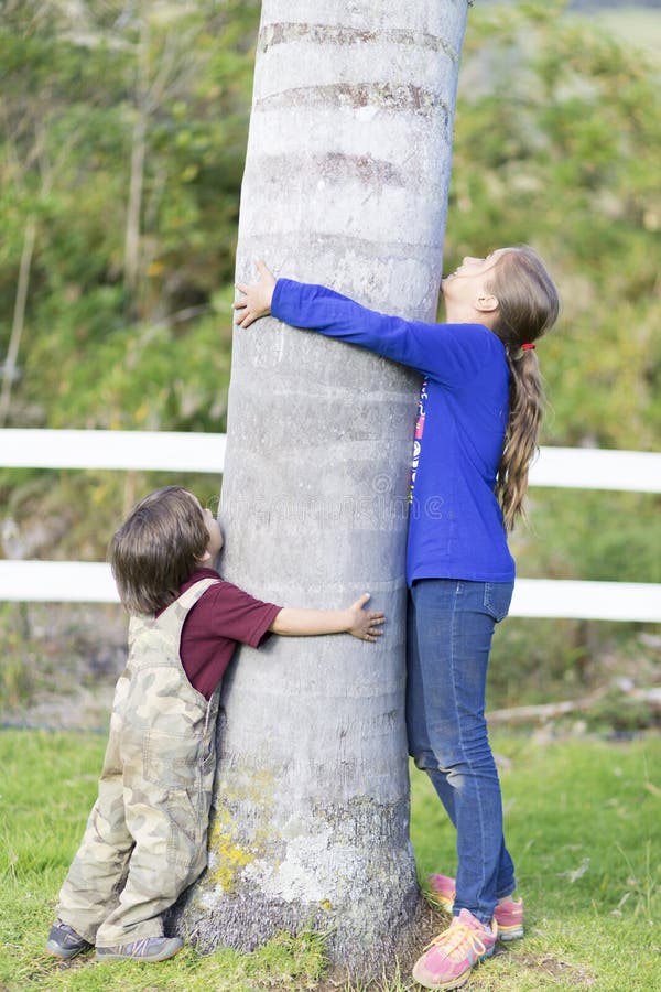 6+ Children hugging tree Free Stock Photos - StockFreeImages