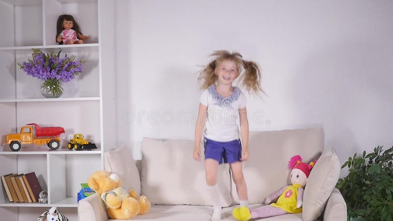 Happy Children Jumping on the Bed and Having Fun. Slow Motion Stock ...