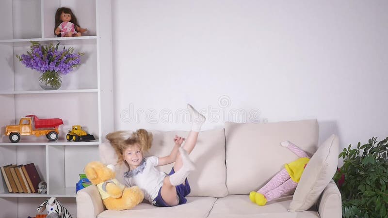 Video: Happy children jumping on the bed and having fun. slow motion ...